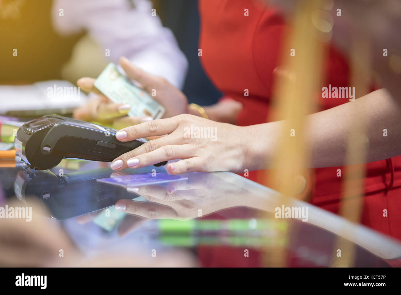 Asian Business women hand using credit card swiping machine for payment ...