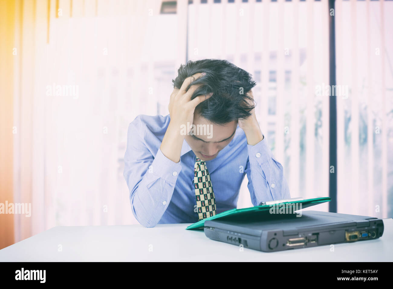 Asian business man serious about the work done until the headache,soft ...