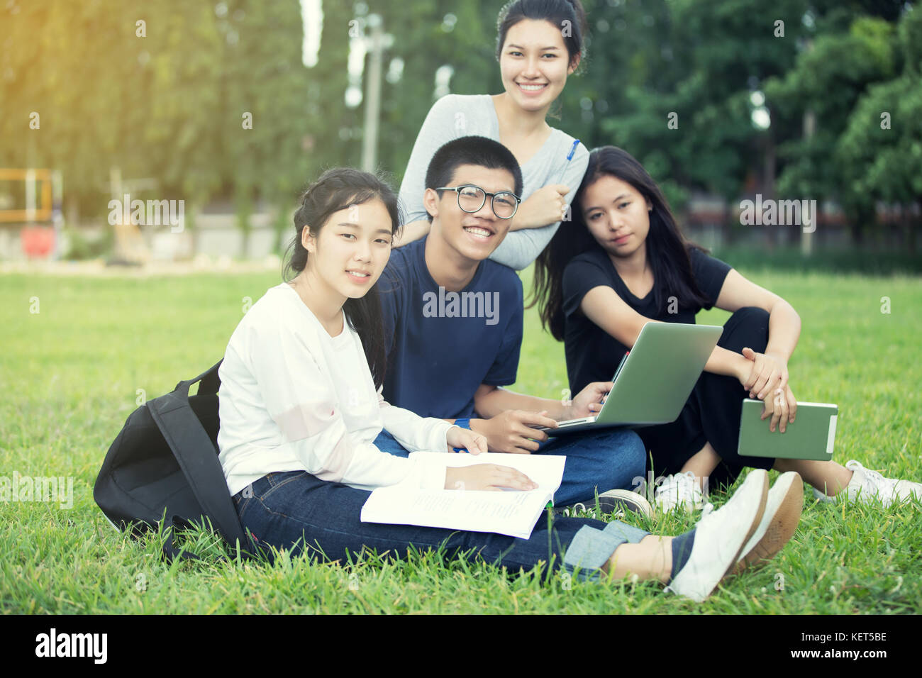 Asian Group of students sharing with the ideas for working on garden ...