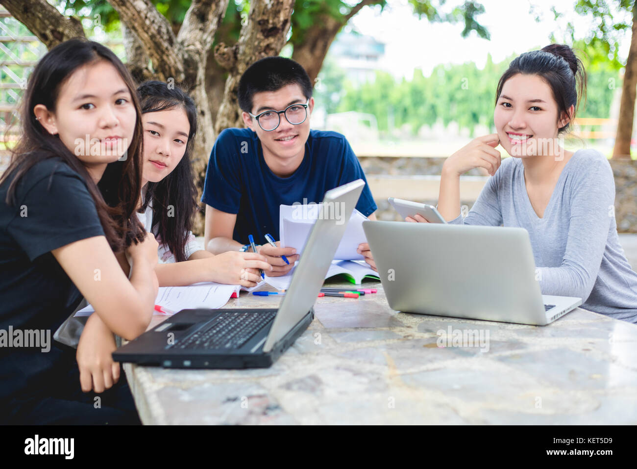 Asian Group of students sharing with the ideas for working on the ...