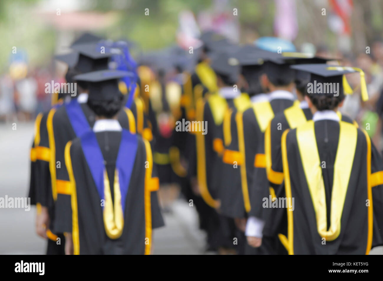 blurry of Graduates are walking the line to get a diploma and selective ...