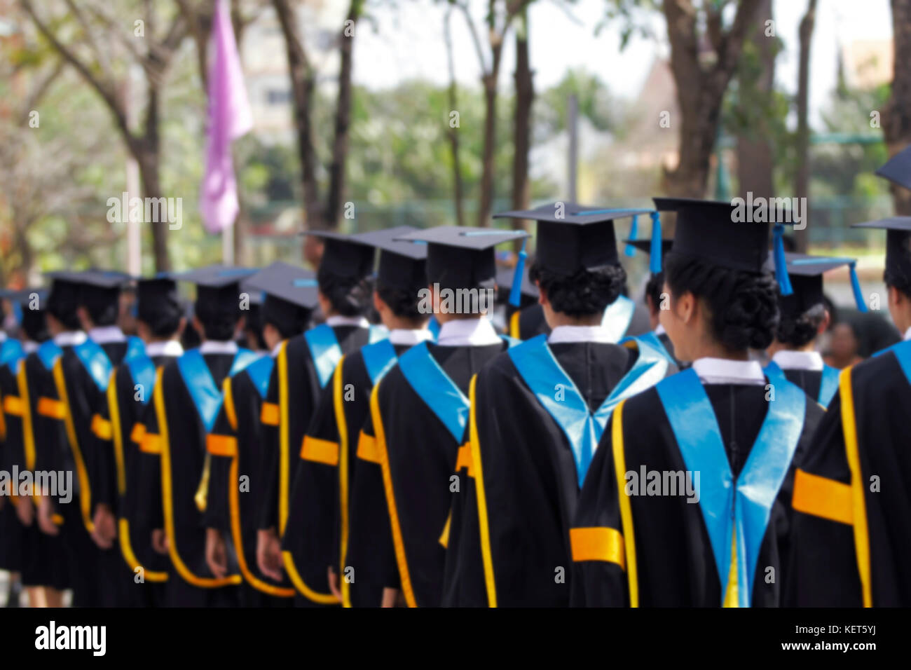 blurry of Graduates are walking the line to get a diploma and selective ...