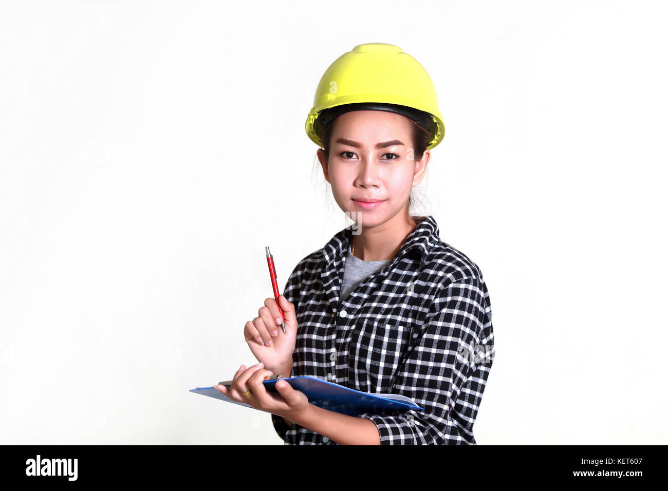 Asian women engineers and technicians are checking the list on the ...