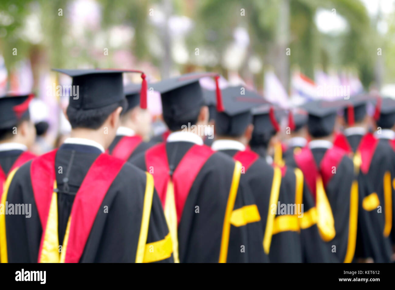 blurry of Graduates are walking the line to get a diploma and selective ...
