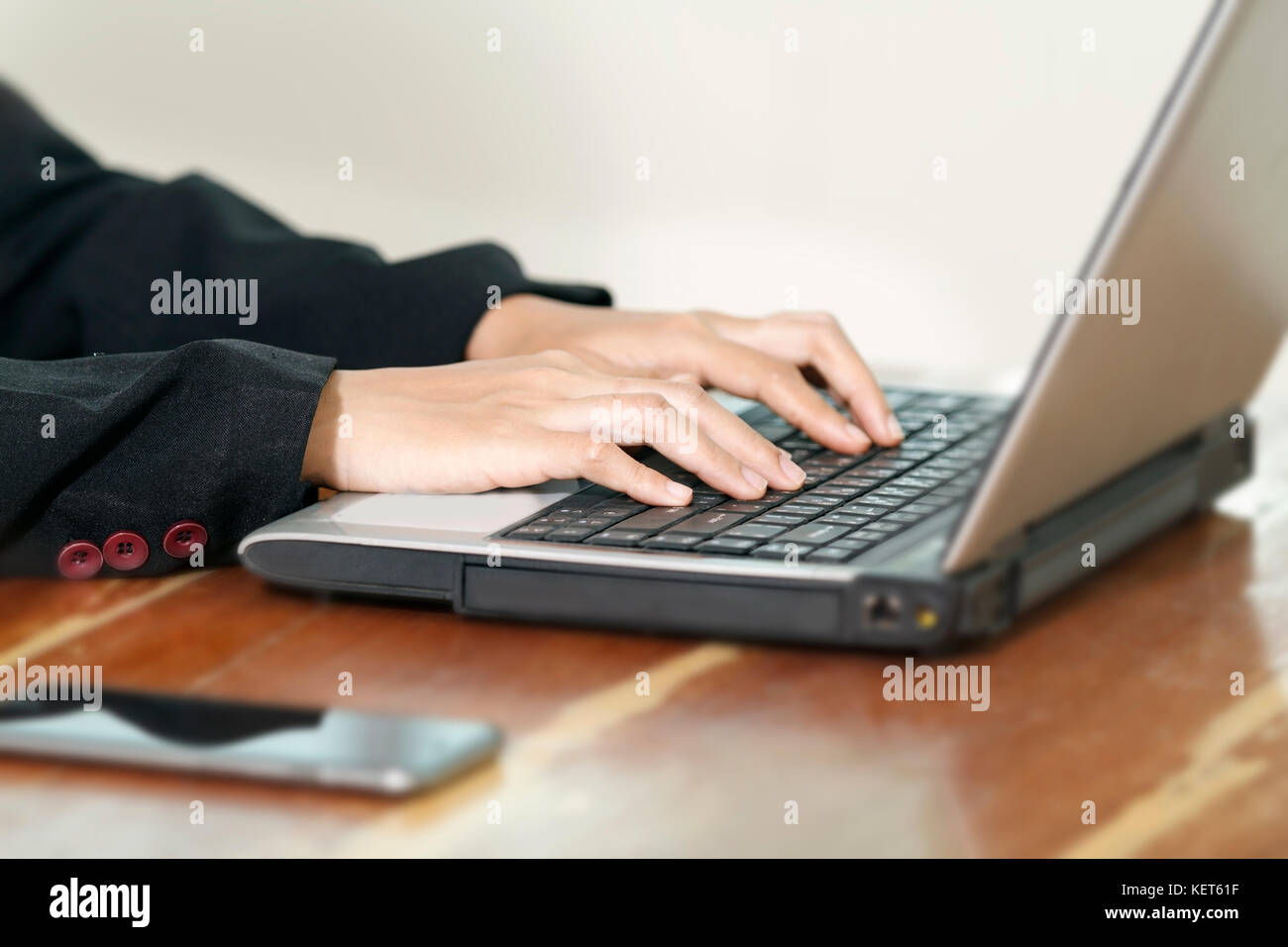 Hands of businesswoman on the keyboard of her laptop computer. Female ...