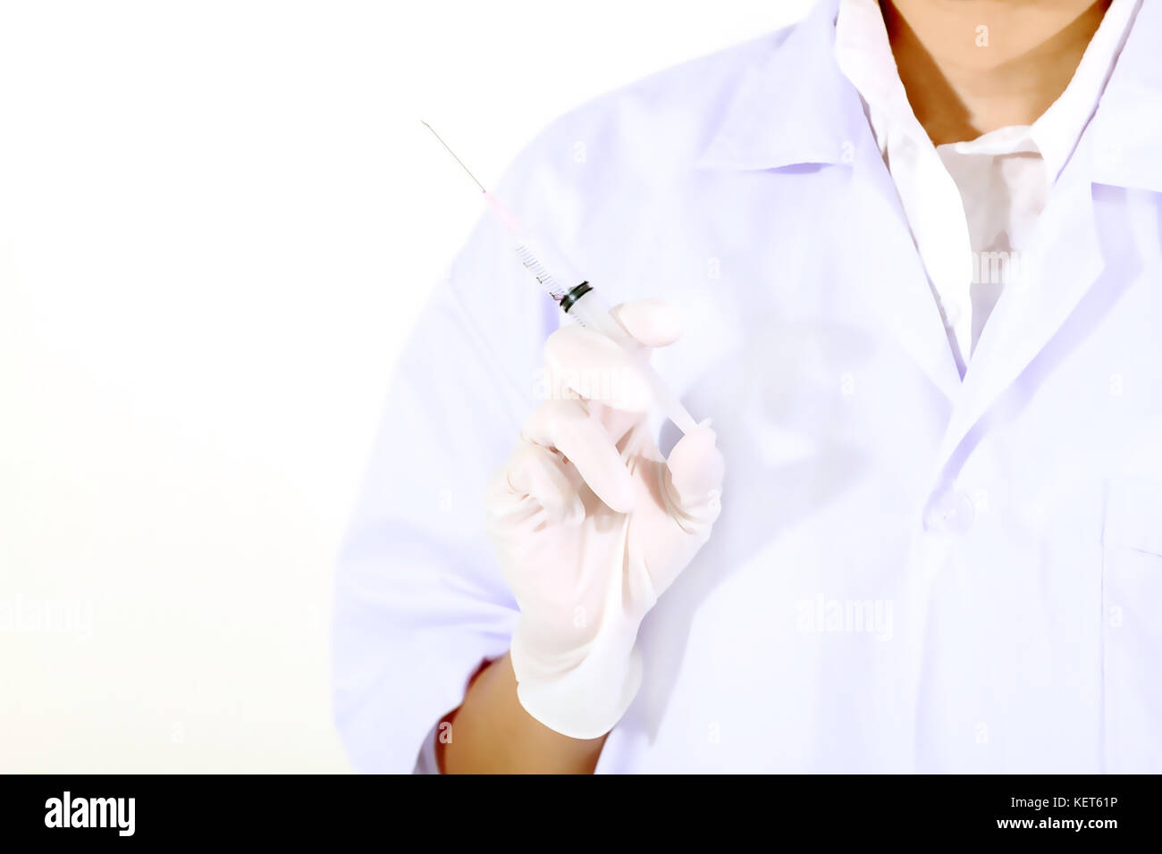 Doctor holding medical injection syringe and Medicine plastic ...