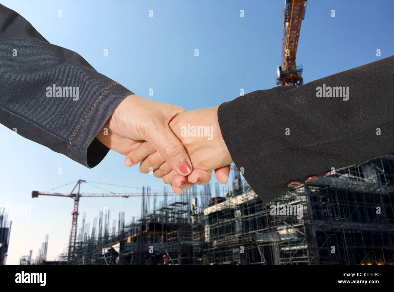 Businesswoman handshake and deal at construction site Stock Photo - Alamy