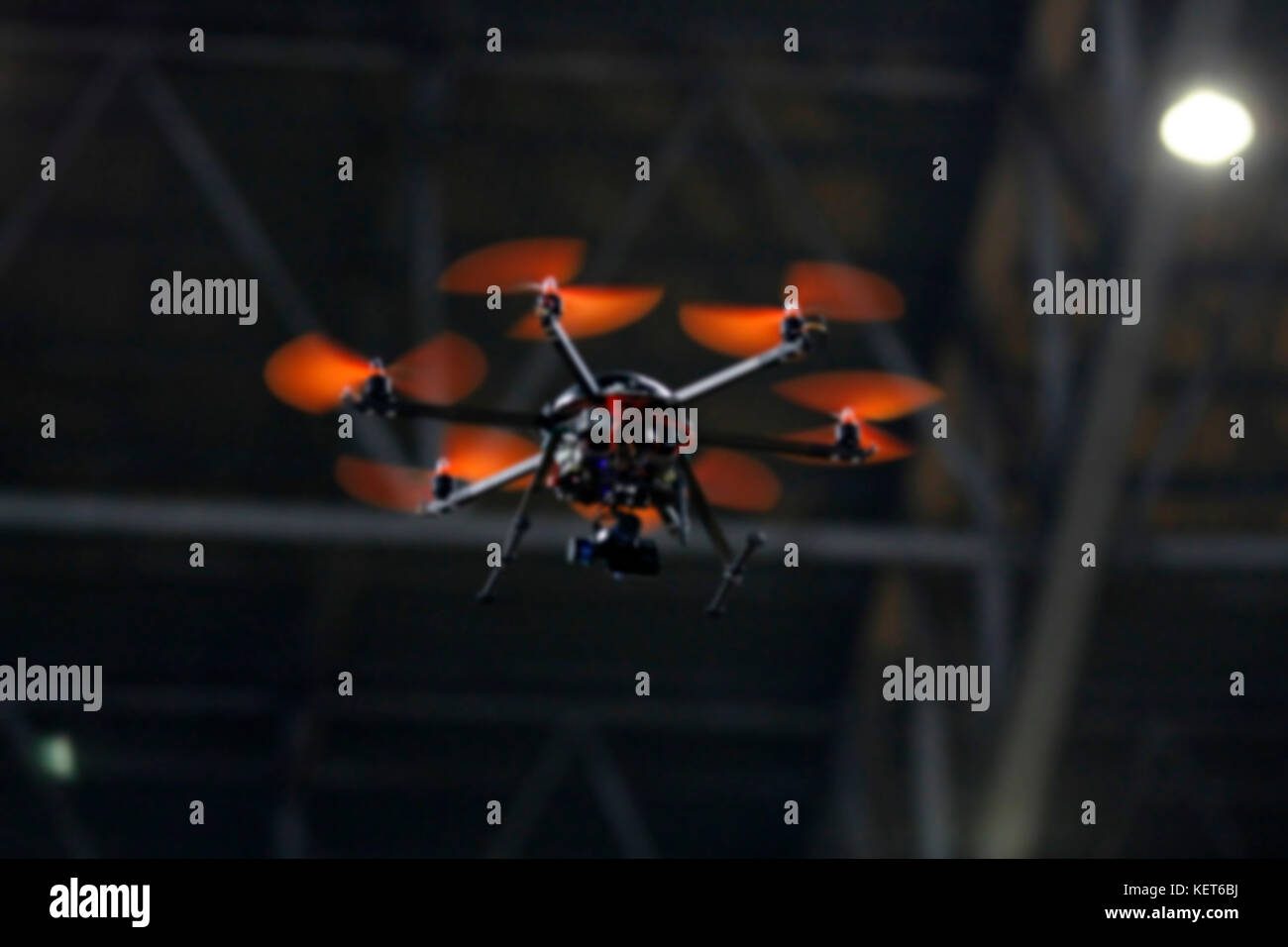 blurry flying drone with camera on the night Stock Photo - Alamy