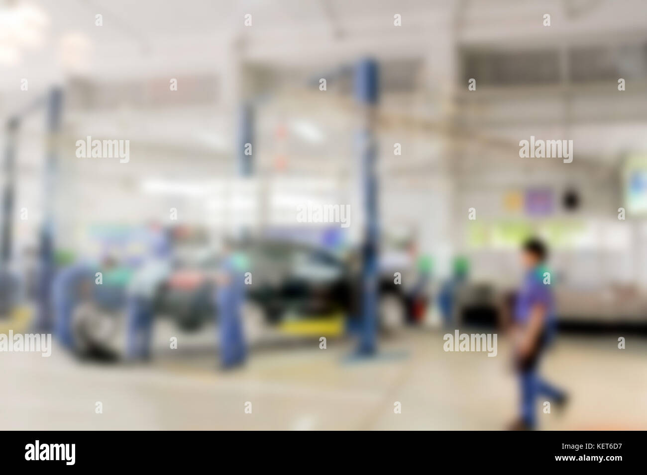 blurry cars on lifts in small service station for background Stock ...