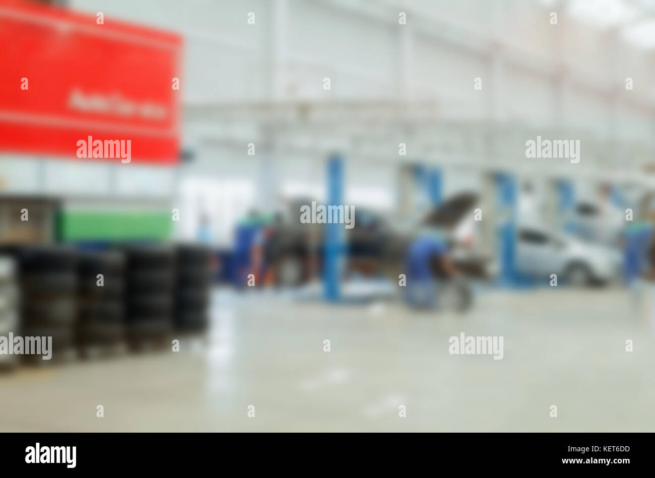 blurry cars on lifts in small service station for background Stock ...