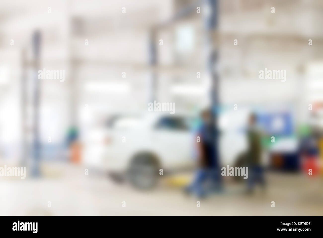 blurry cars on lifts in small service station for background Stock ...