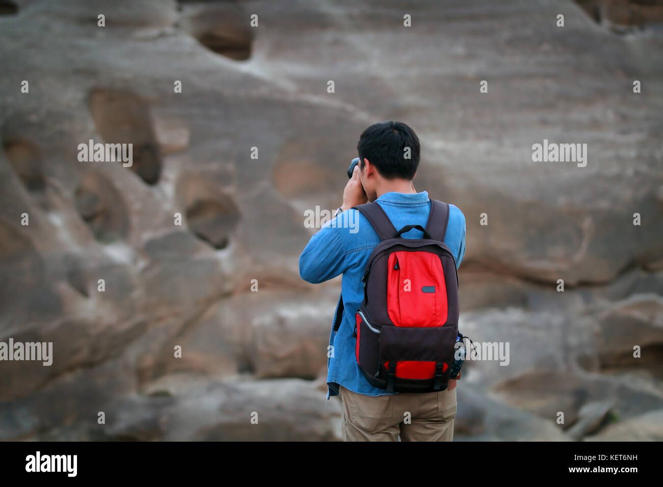 A man asia with backpack taking a photo on the top of mountains ,soft ...