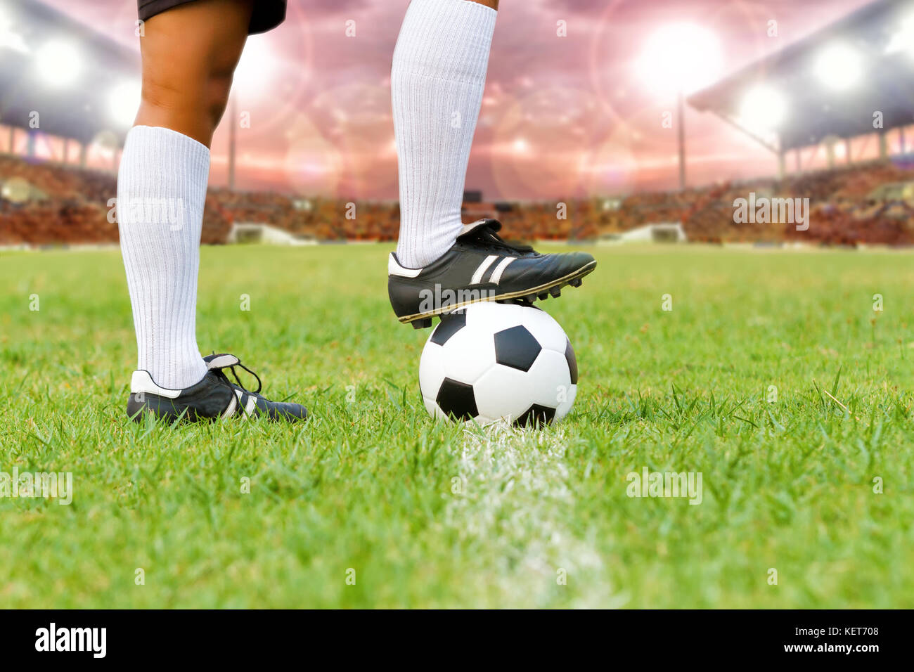 soccer or football player standing with ball on the field for Kick the ...
