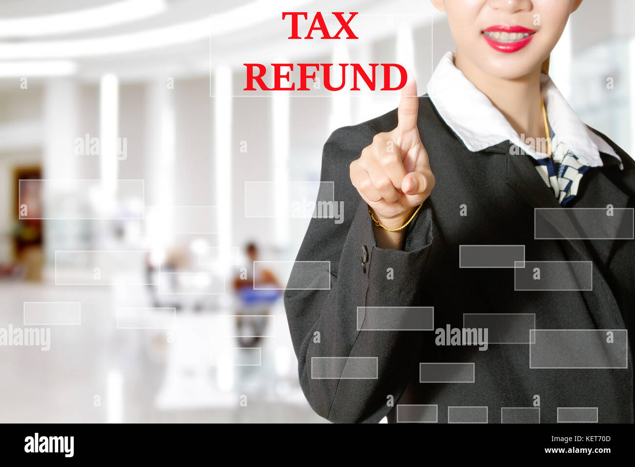 Asian Businesswomen hand touching TAX REFUND sign on virtual screen ...