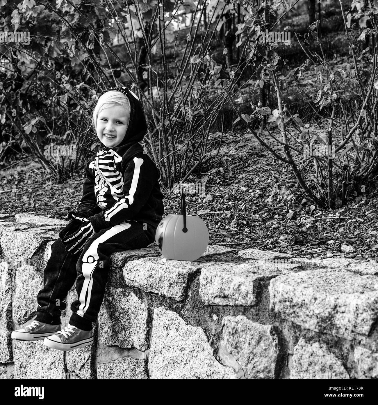 Trick or Treat. happy child wearing skeleton costume on Halloween ...