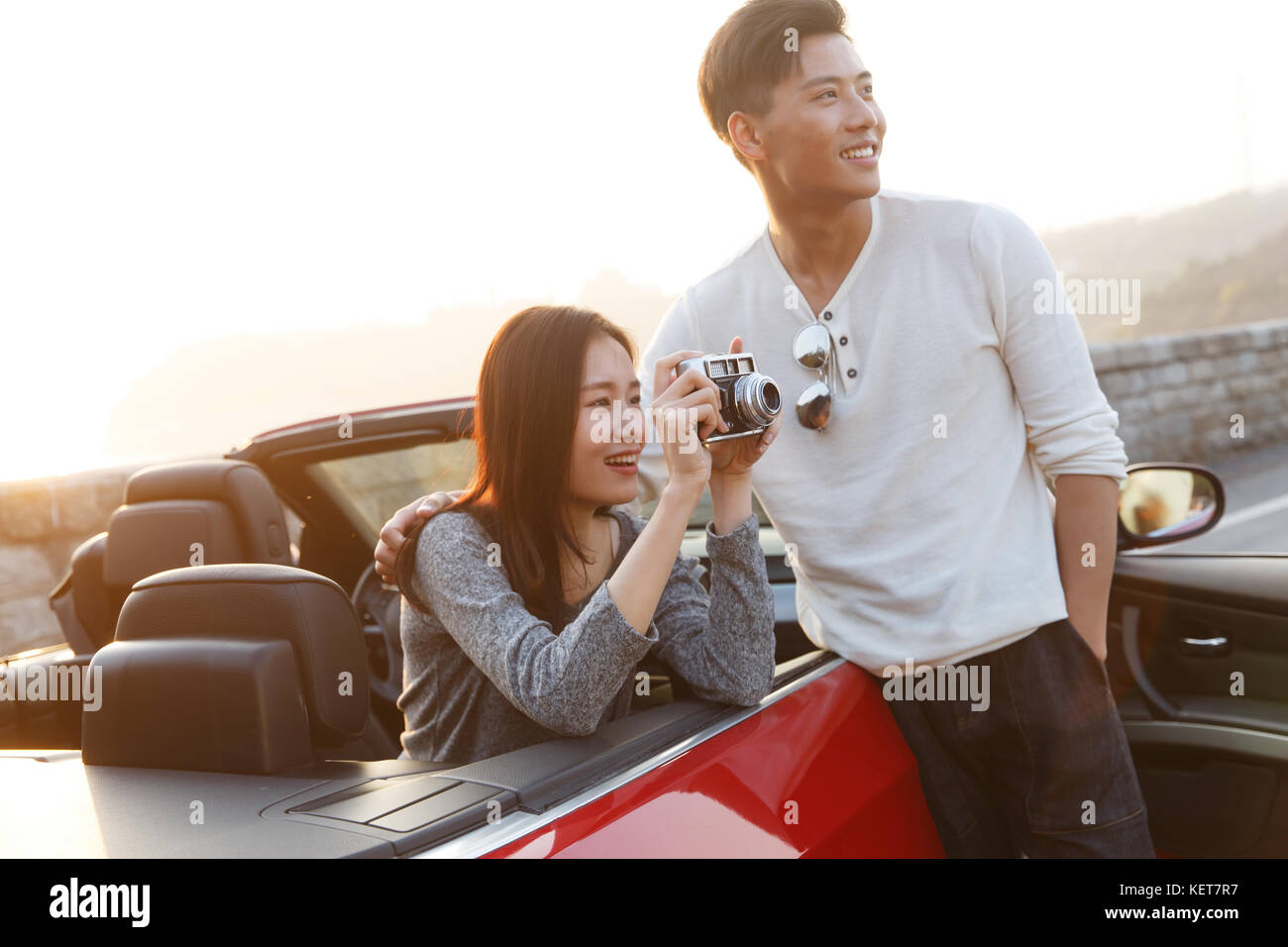 Young couple driving Stock Photo - Alamy