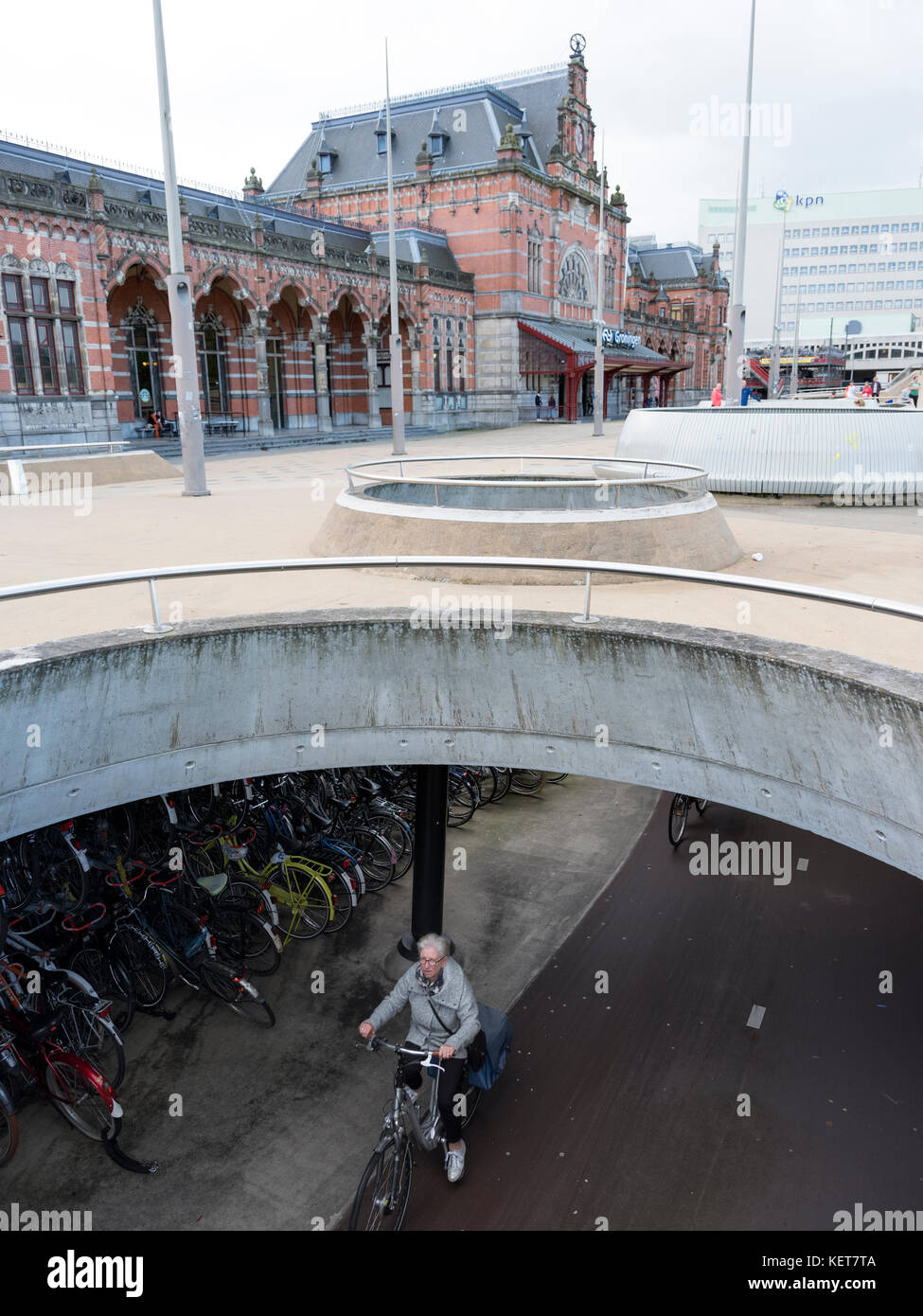 bike on bicycle track under square in front of railway station ...