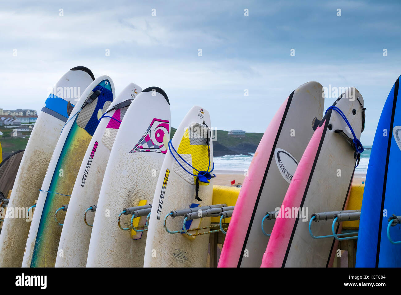 Surfing Fistral Beach - assorted surfboards stacked in a storage rack ...