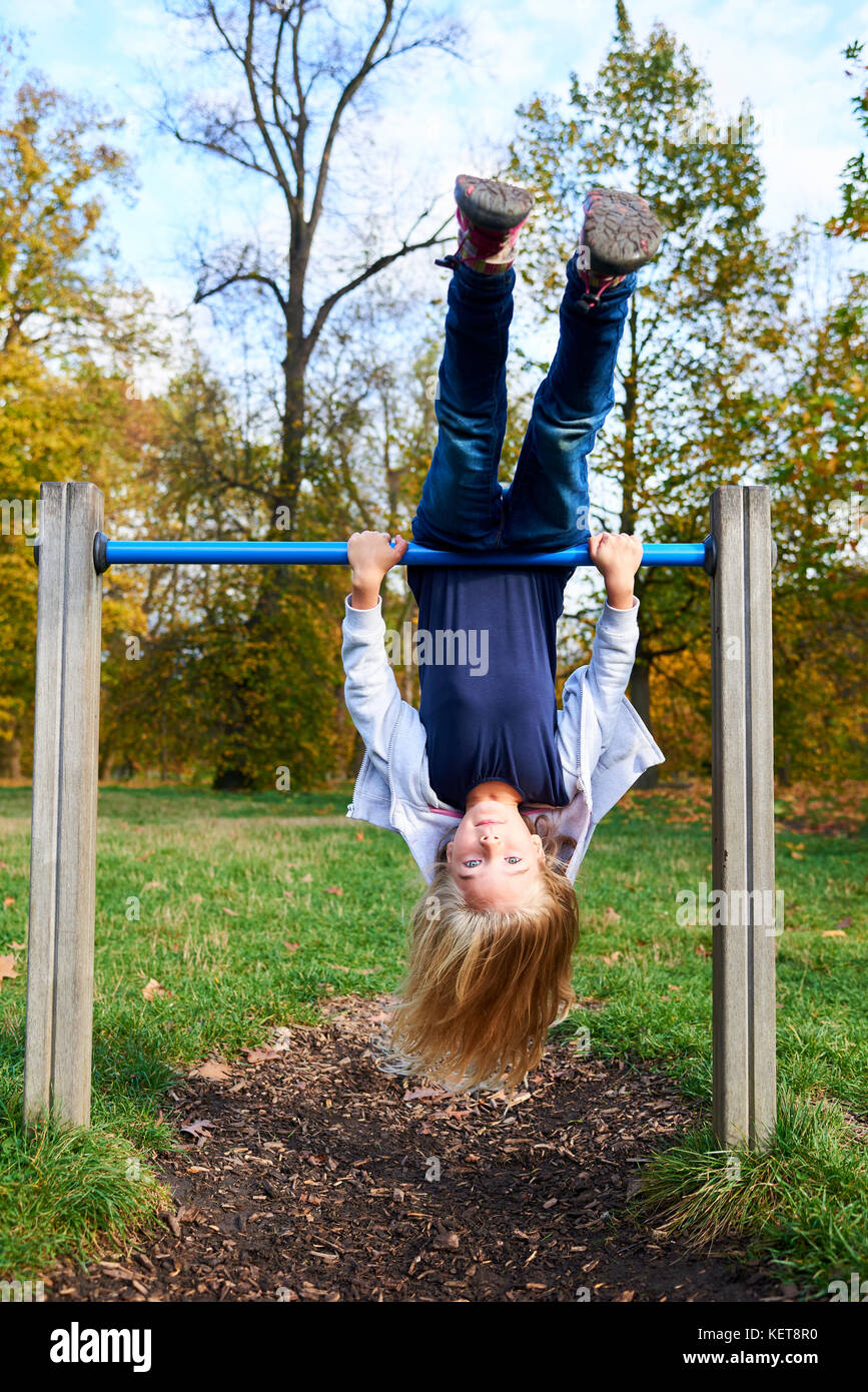 Child Hanging Upside Down On Climbing High Resolution Stock Photography and Images - Alamy