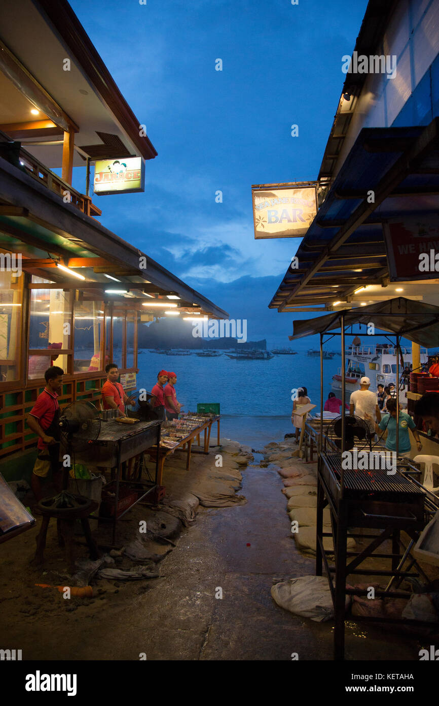 Seafood restaurants at dusk in El Nido, Palawan Island Stock Photo - Alamy