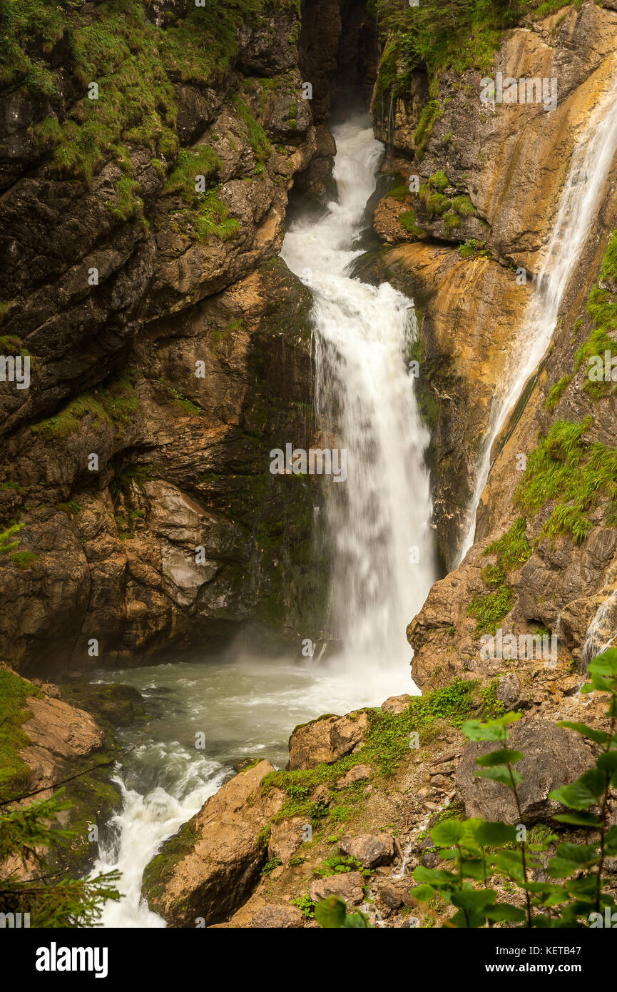 View of a waterfall near Hallstatt in the Austrian alps Stock Photo - Alamy