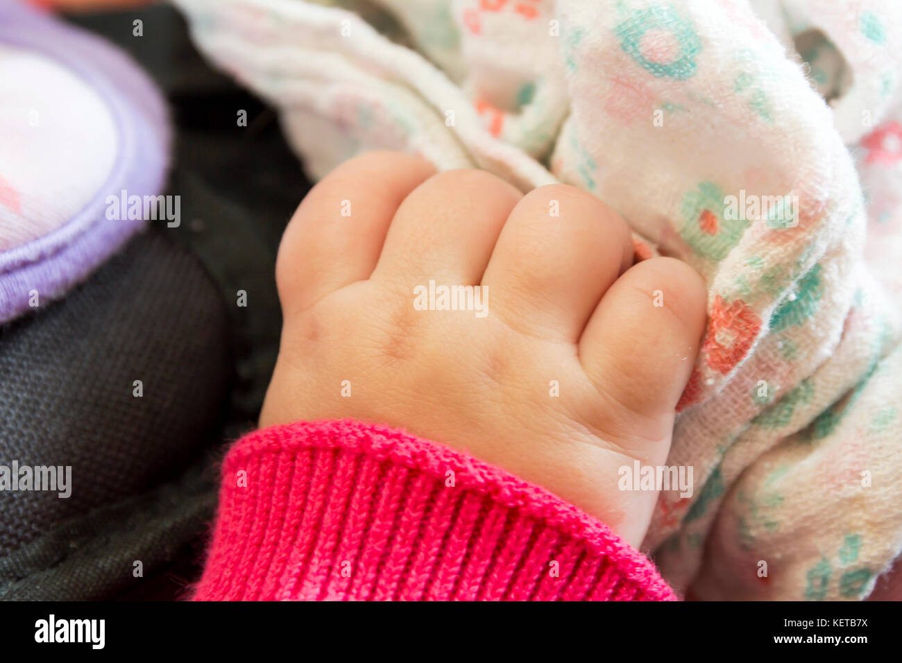 Baby's Hand clutching a Comfort Blanket whilst dozing off to sleep ...