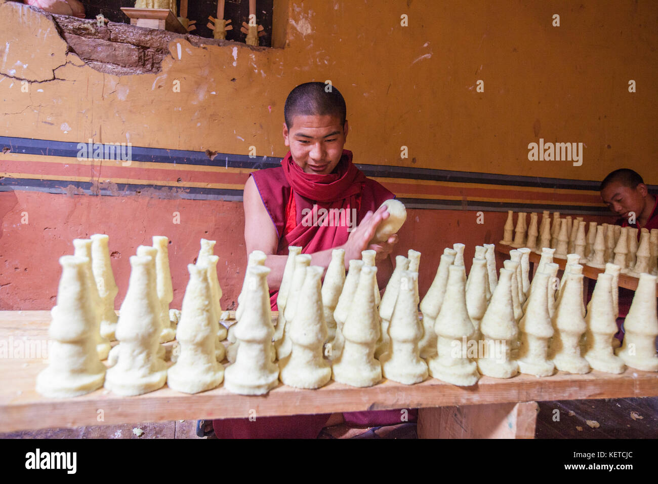 Buddhist monks create typical handicraft in the monastery of Thimphu ...