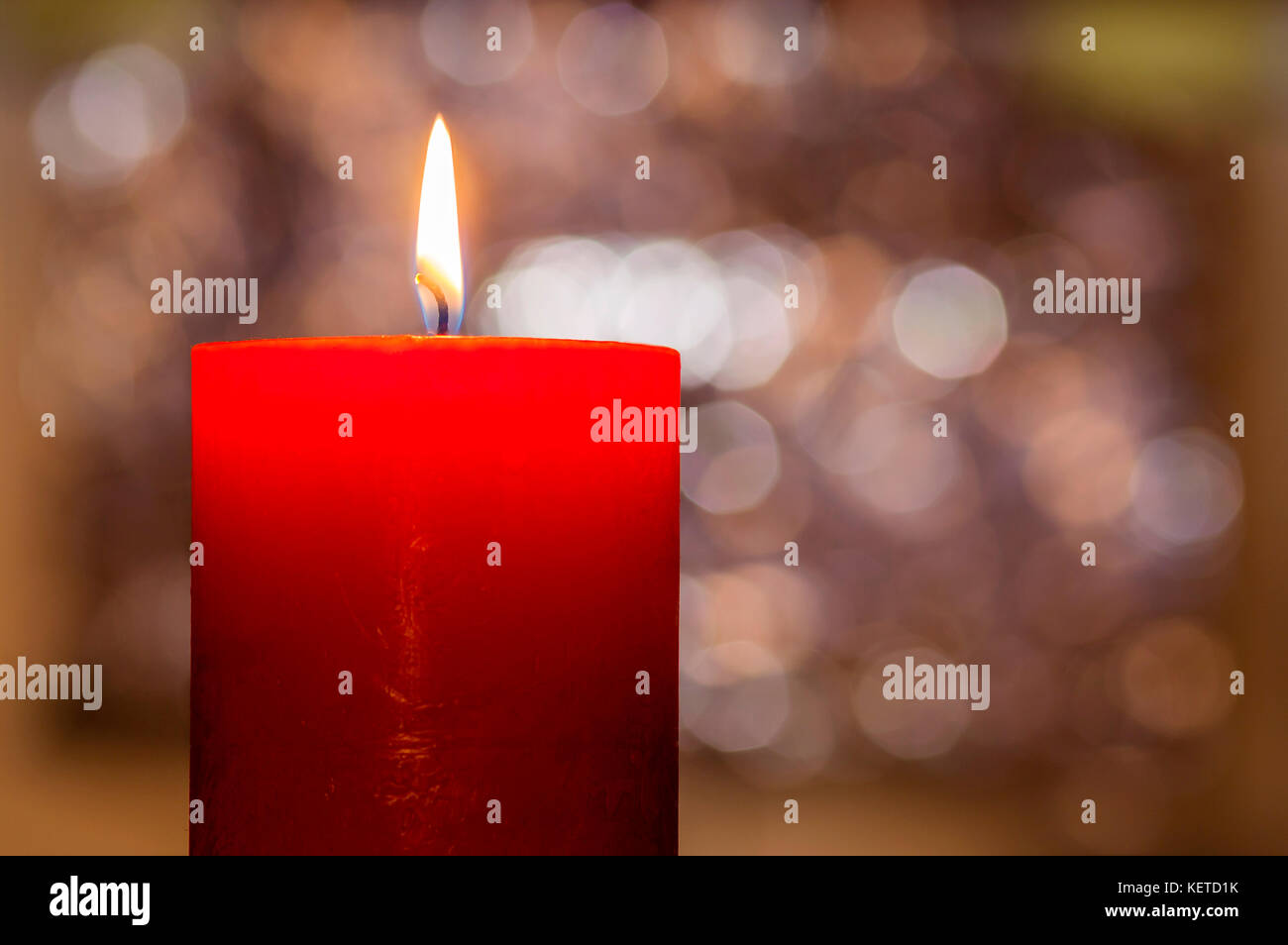 One golden burning advent candle hi-res stock photography and images ...