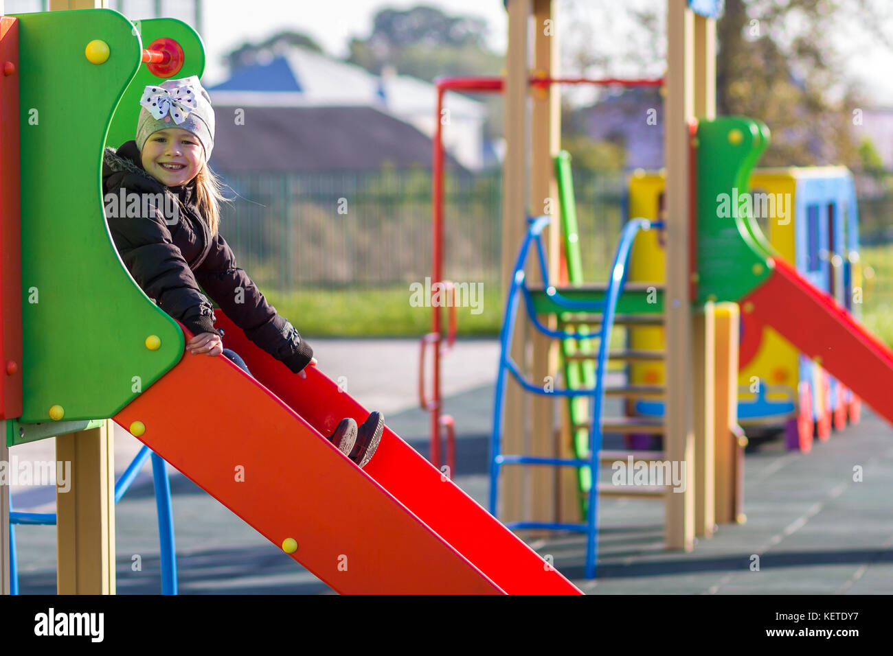 Child little pretty girl playing on playground outdoors Stock Photo - Alamy