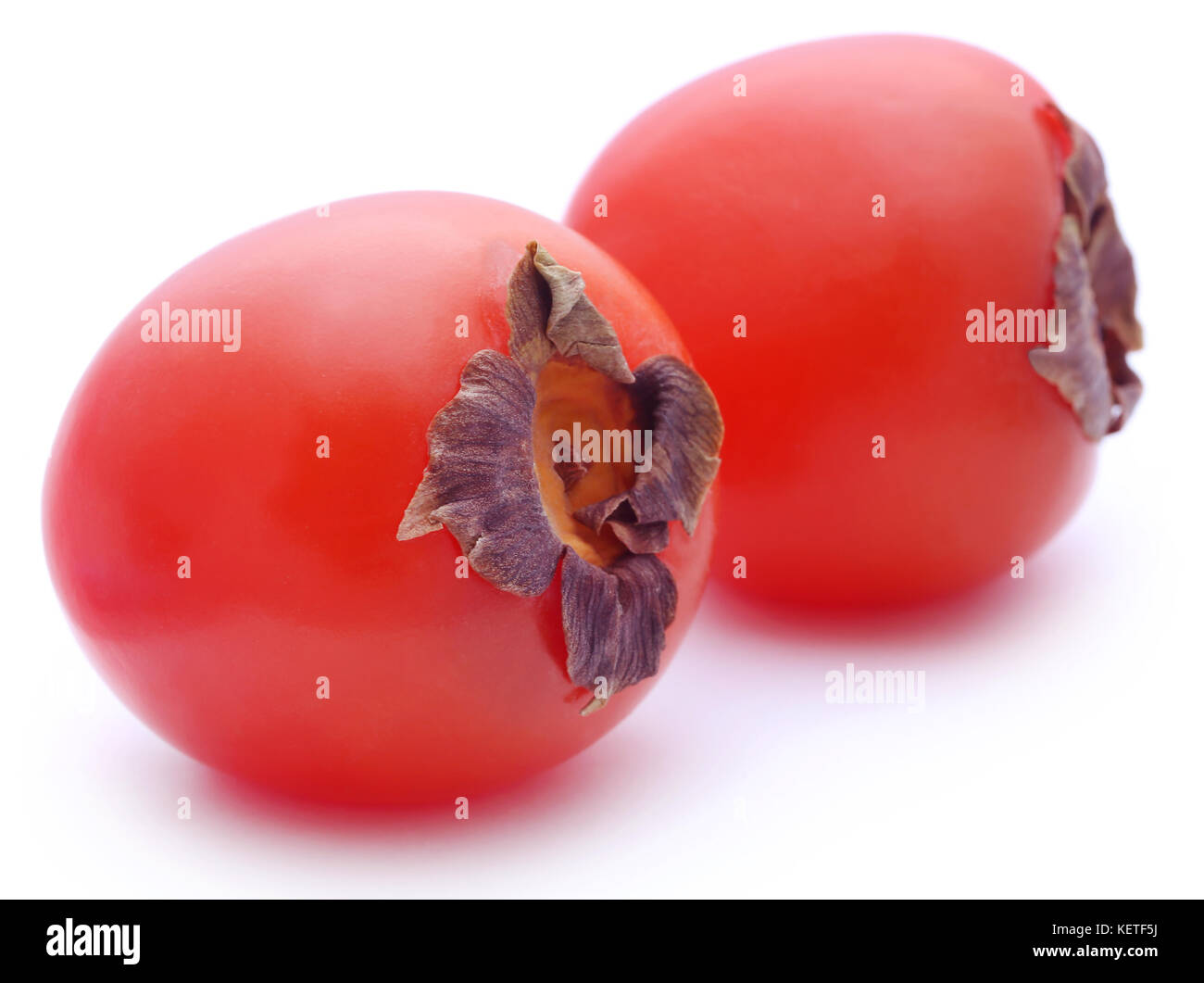 Fresh ripe persimmon over white background Stock Photo - Alamy
