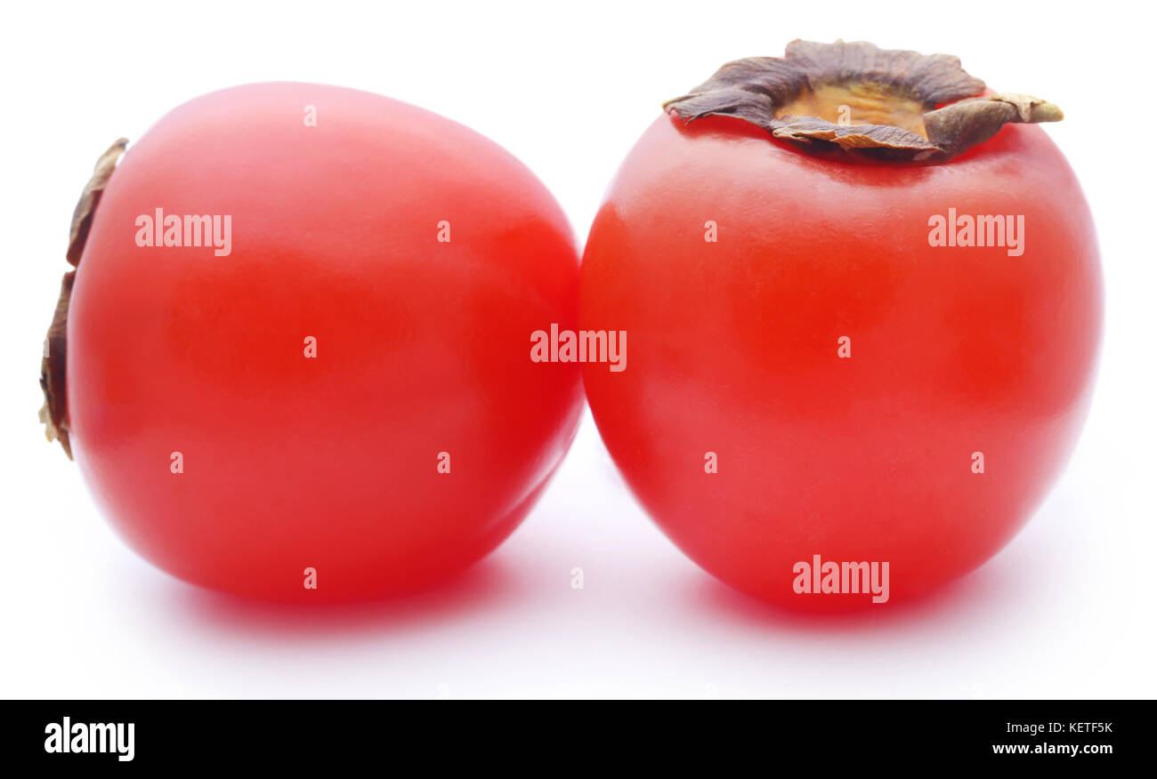 Fresh ripe persimmon over white background Stock Photo - Alamy