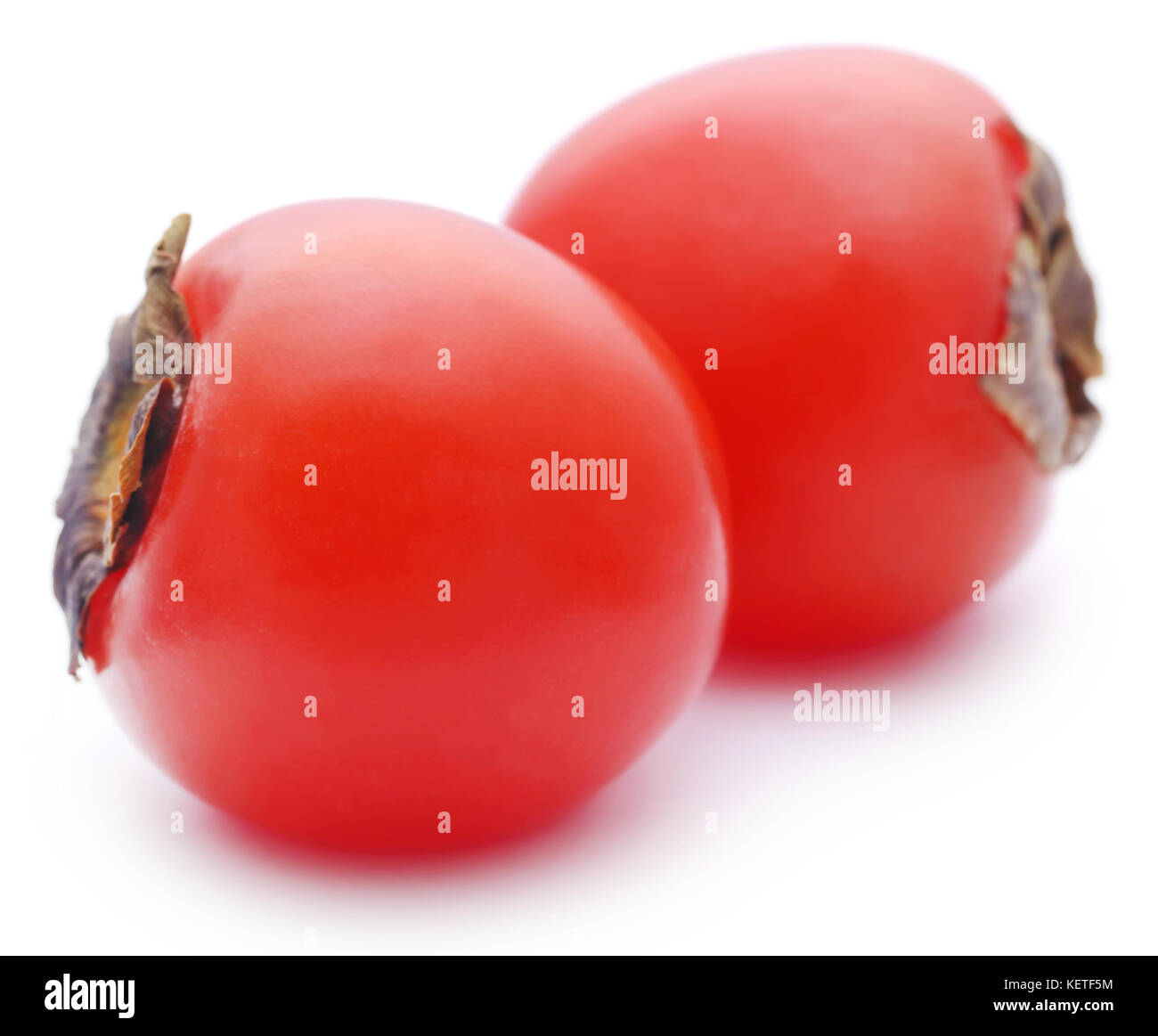 Fresh ripe persimmon over white background Stock Photo - Alamy