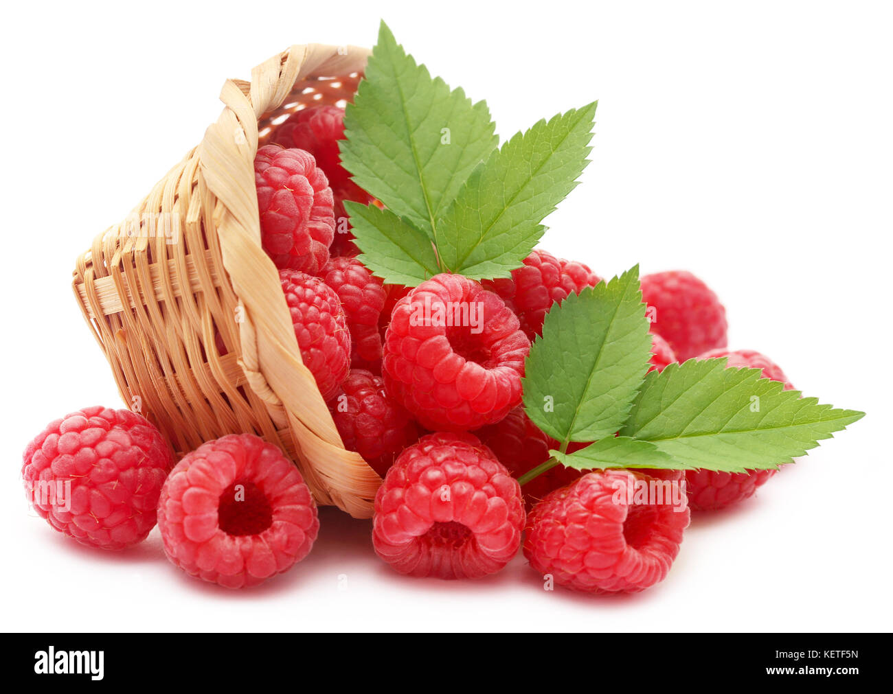 Fresh Raspberry in a basket over white background Stock Photo - Alamy