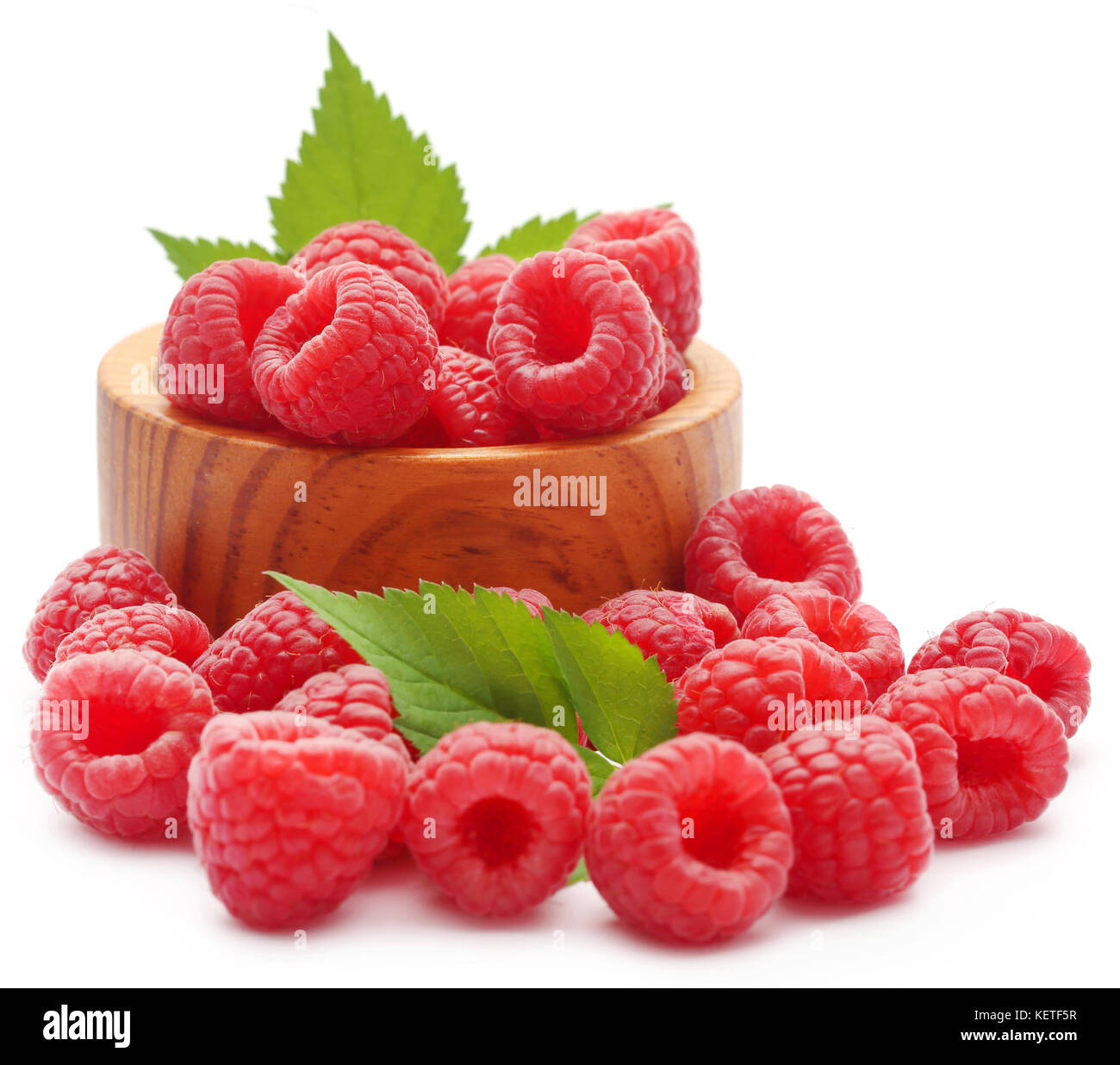 Fresh Raspberry in a basket over white background Stock Photo - Alamy