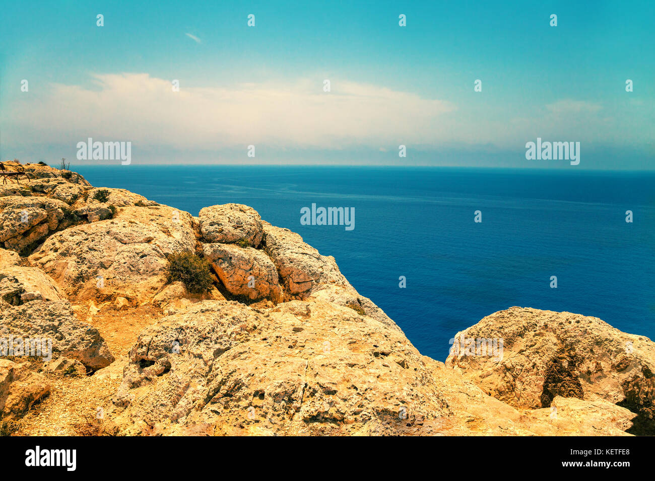 View of the open sea. Rocky seashore with blue sky Stock Photo - Alamy