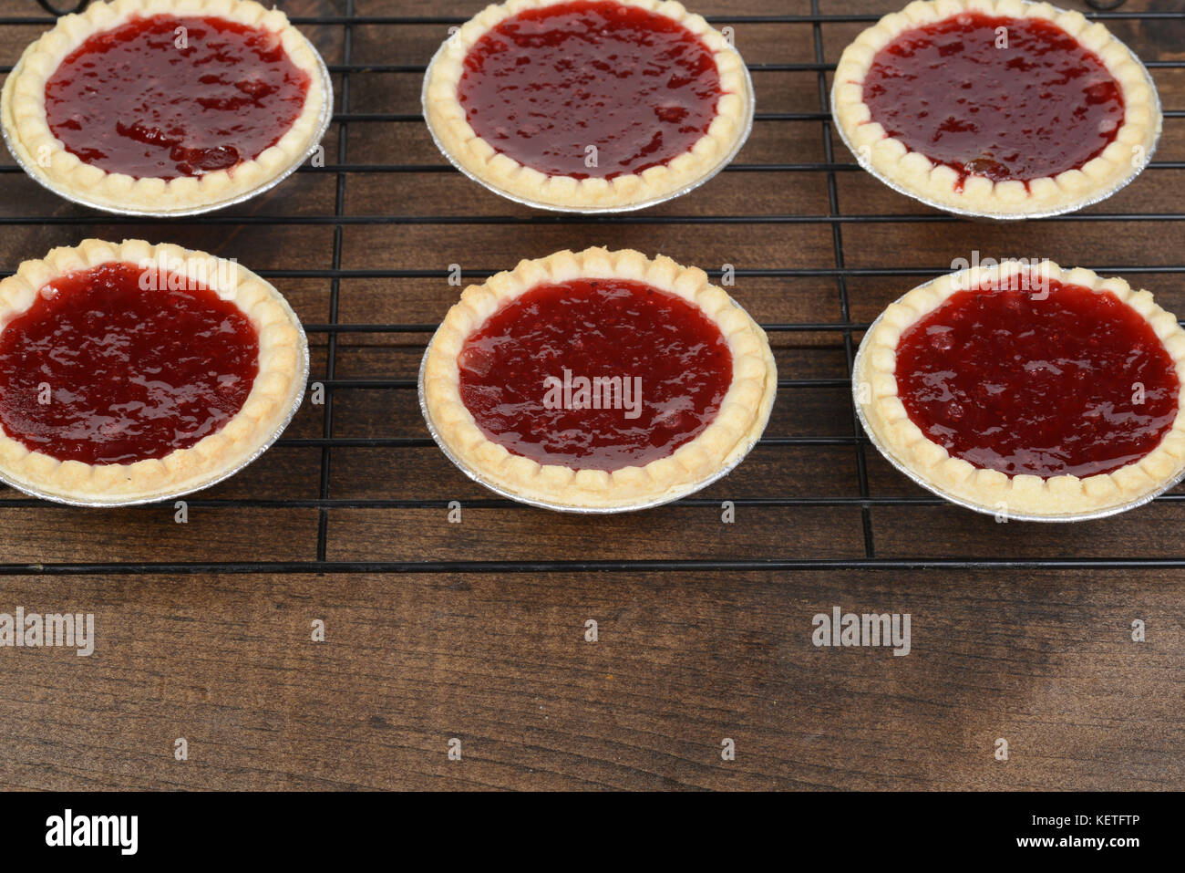 strawberry tarts cooling on rack Stock Photo - Alamy