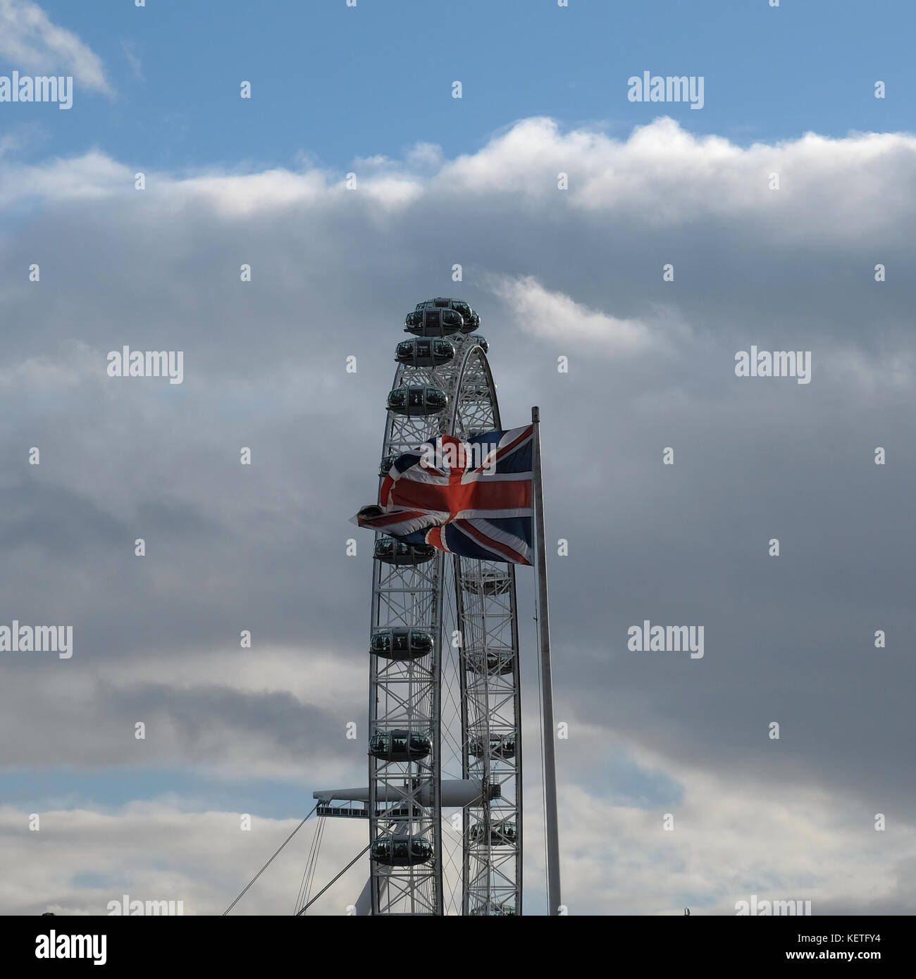 British flag in front of cloudy sky hi-res stock photography and images ...