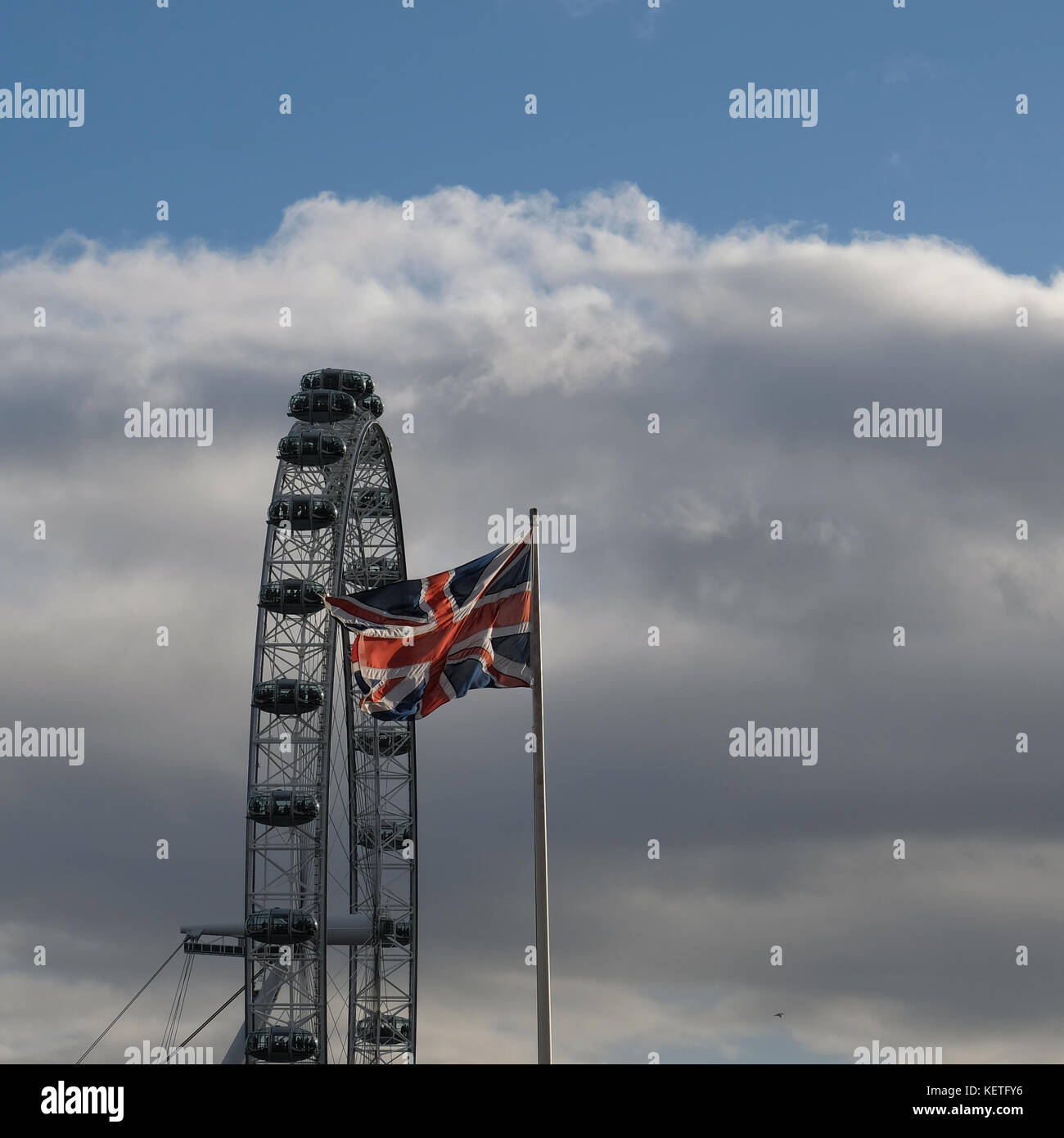 British flag in front of cloudy sky hi-res stock photography and images ...