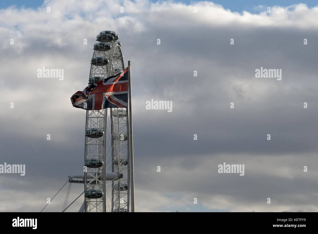 British Union Jack flag flying in front of The London Eye Stock Photo ...