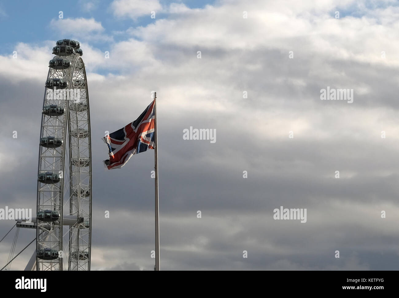 British flag in front of cloudy sky hi-res stock photography and images ...