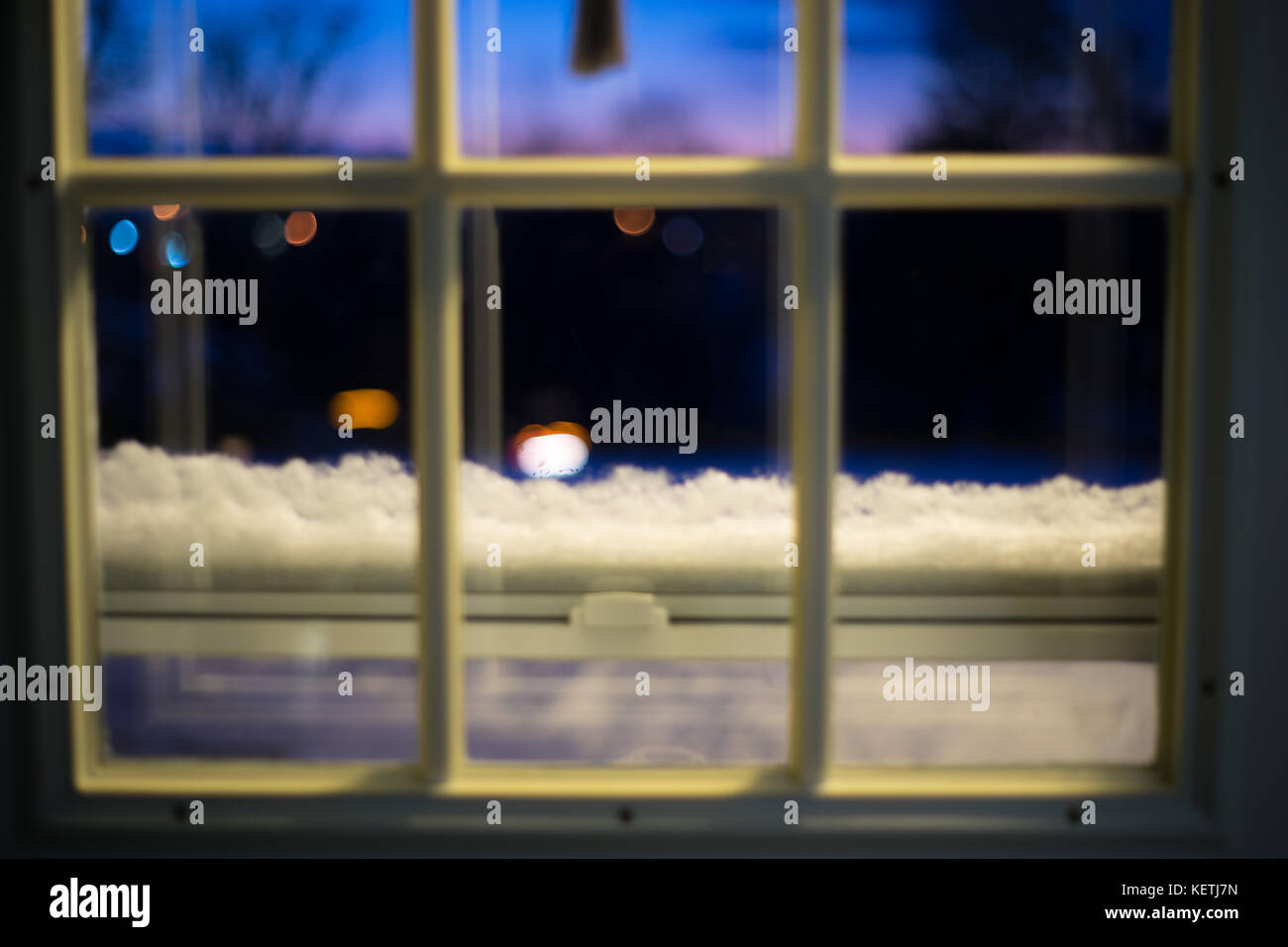 Looking out the Window on a Cold Winter Evening Stock Photo - Alamy