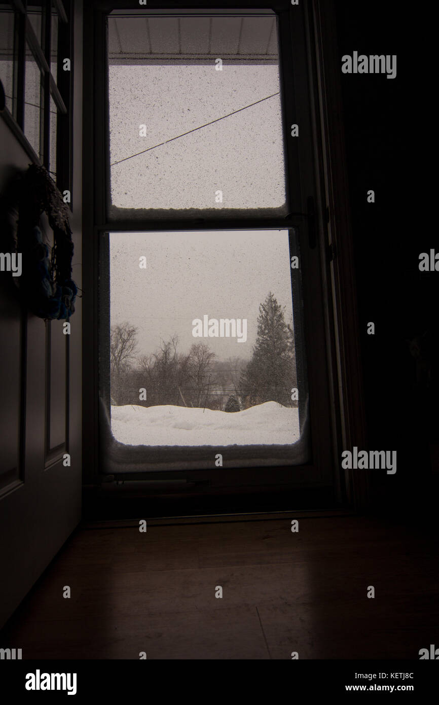 Looking outside through the front door on a winter's day Stock Photo ...