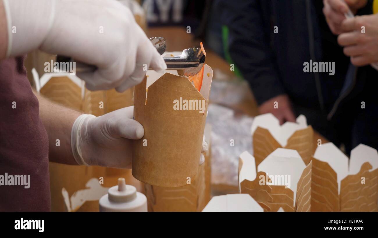 Hands putting take-out food container, close-up. Food delivery. Close ...