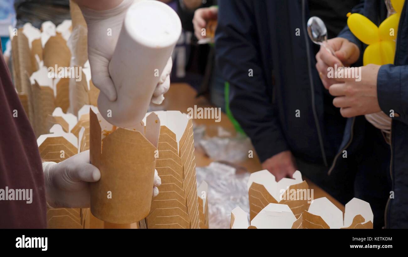 Hands putting take-out food container, close-up. Food delivery. Close ...