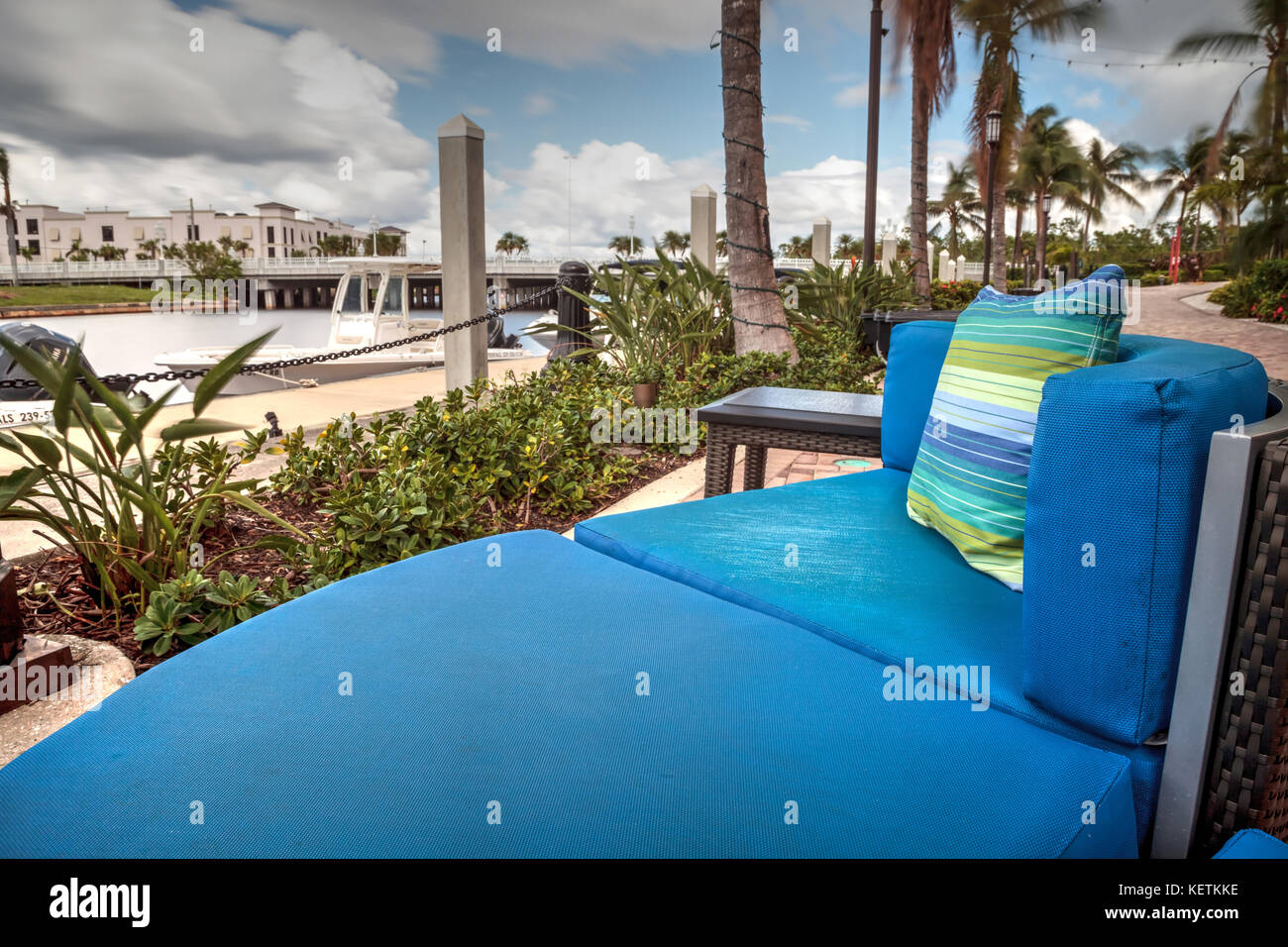 Tropical blue couch furniture with a view in summer Stock Photo - Alamy