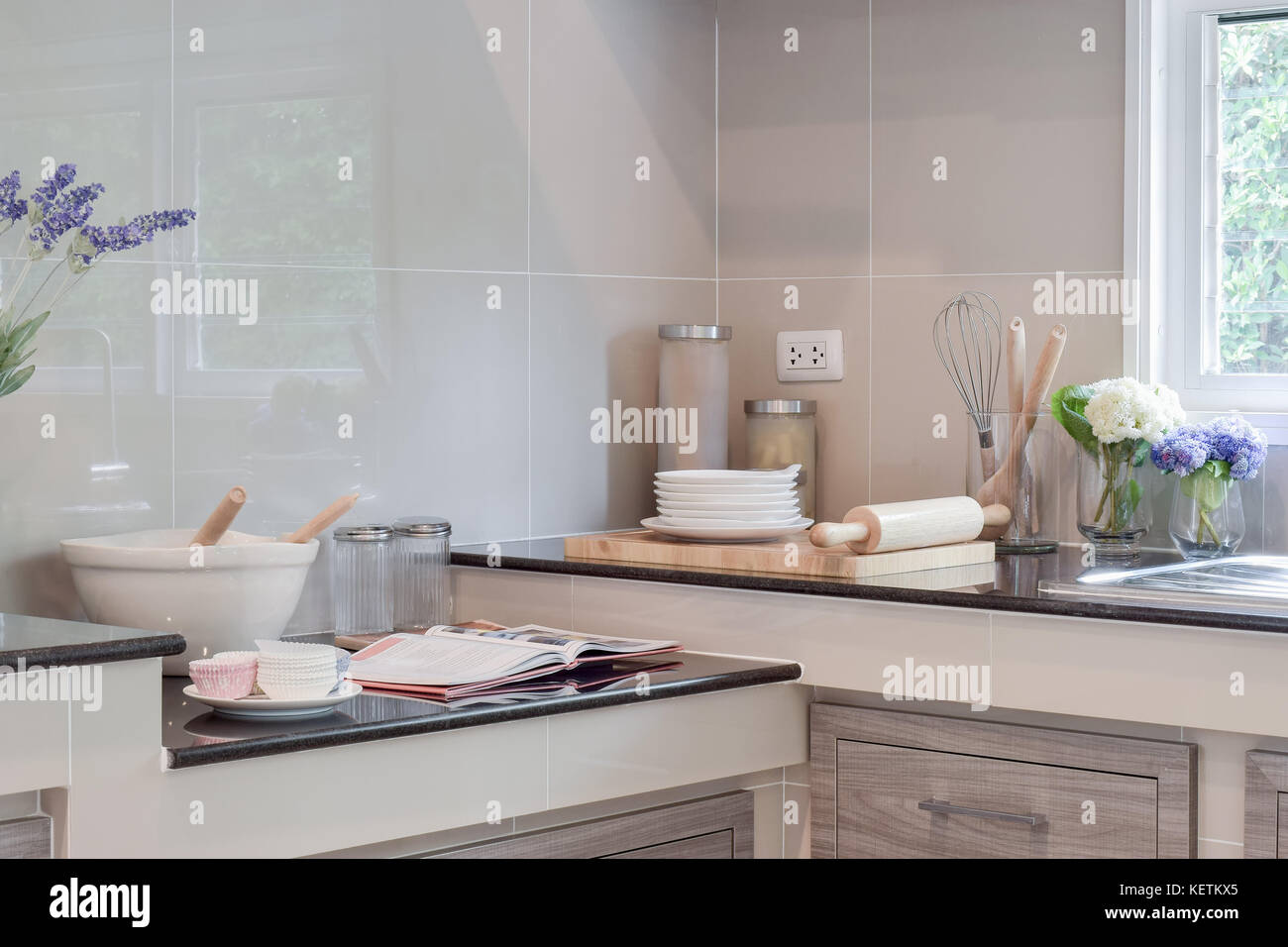 Ceramic ware and kitchen ware setting up on the counter in the kitchen ...