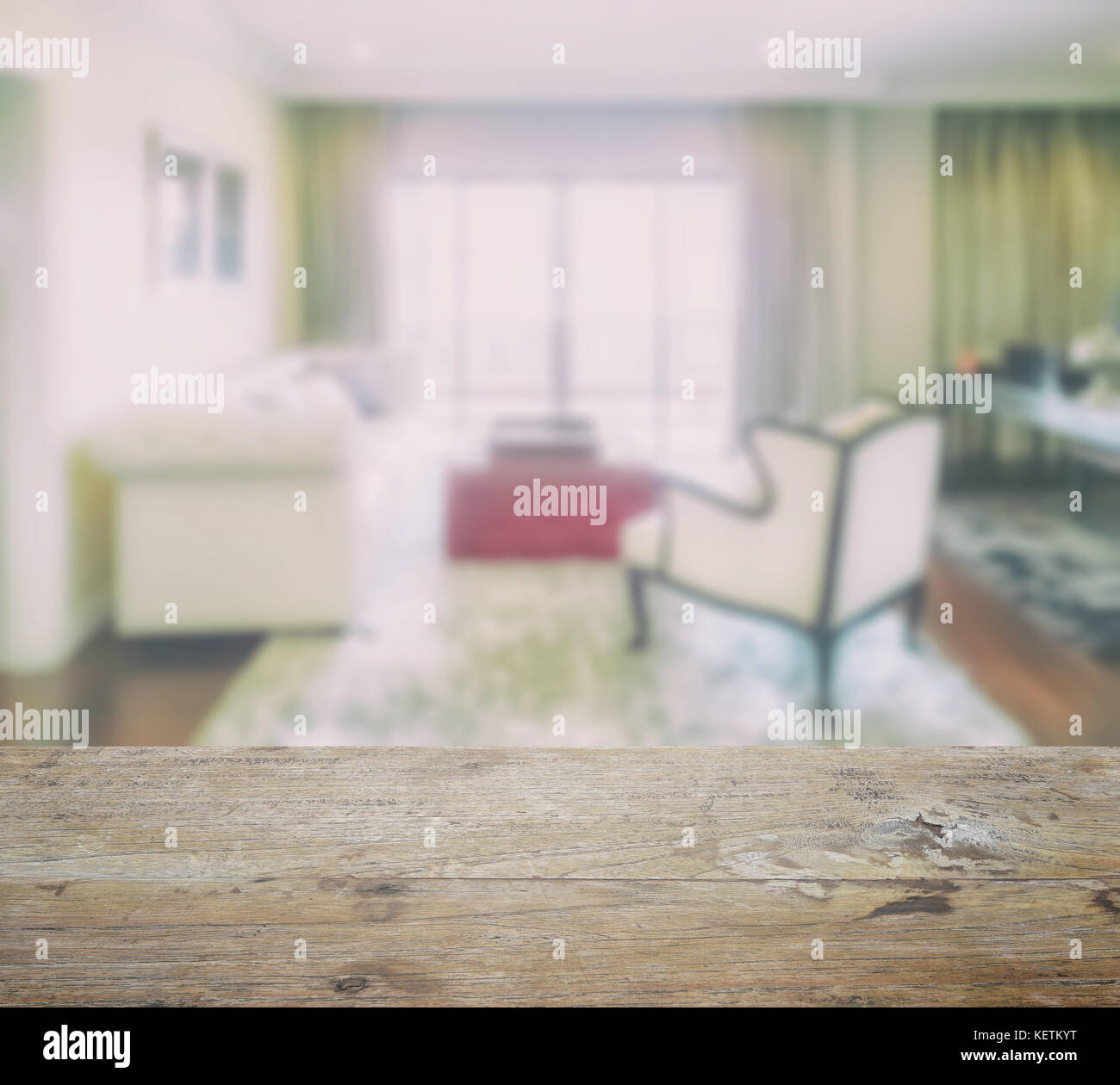 wooden table top with blur of luxury living room interior Stock Photo ...