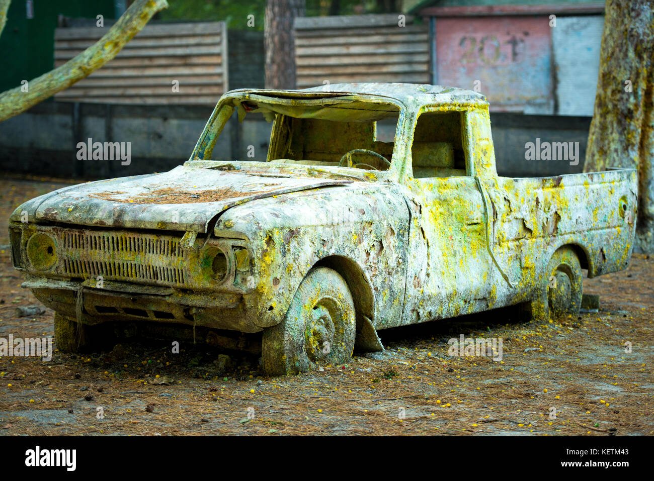 An old rusty car in paint from paintball Stock Photo - Alamy