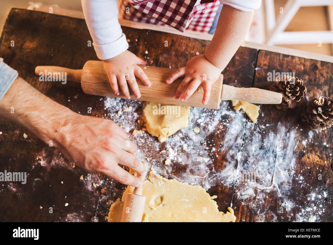 Young family making cookies at home Stock Photo - Alamy