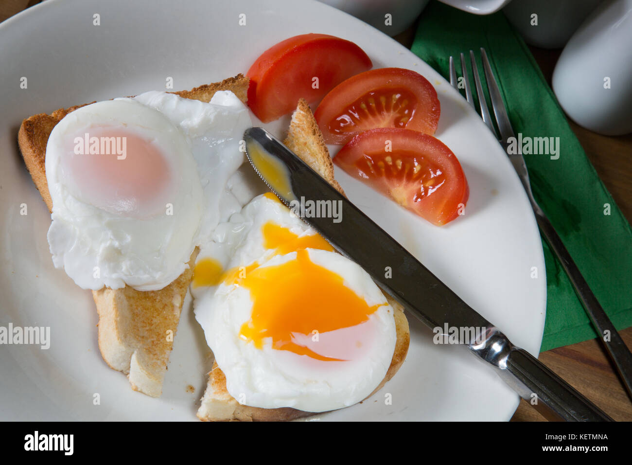 Typical English breakfast of poached eggs on toasted bread Stock Photo ...